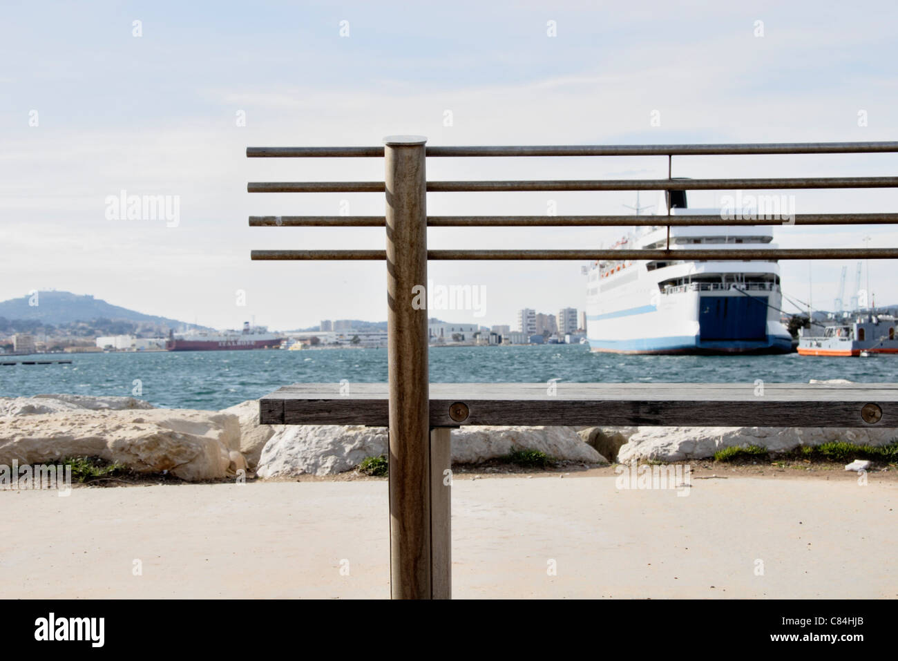 View of harbor through bench Stock Photo - Alamy