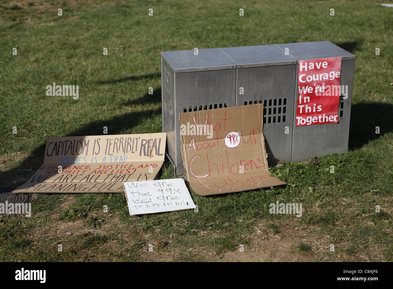Occupy Bloomington Wall Street protest signs at Peoples Park. The ...
