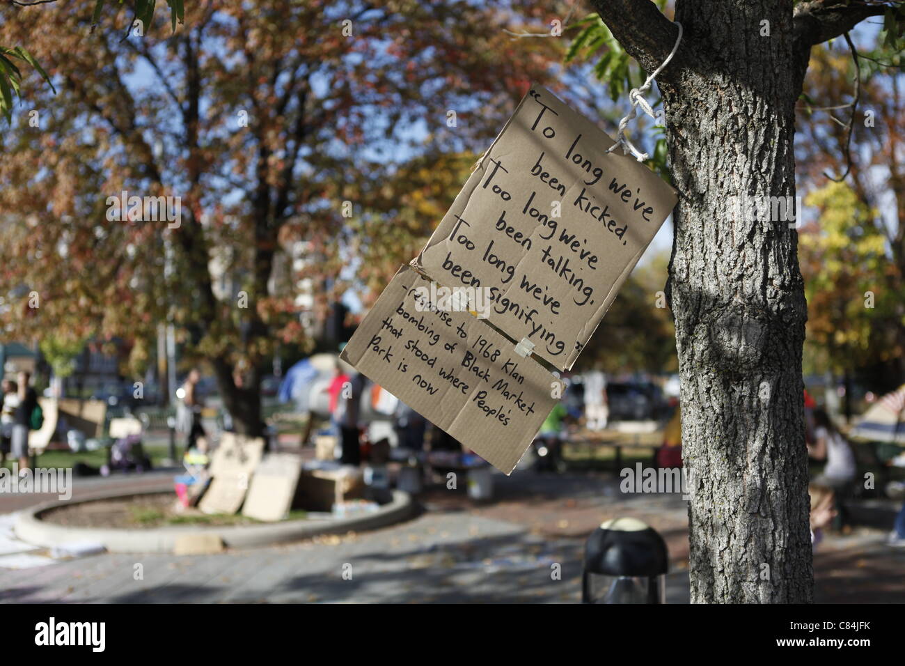 Occupy Bloomington Wall Street protest signs at Peoples Park. The ...