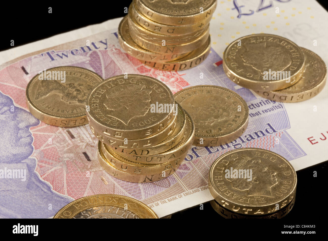 British pound coins on a £20 note Stock Photo - Alamy