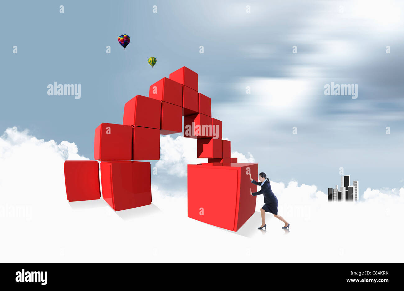 A woman pushing the red box into other stacked boxes Stock Photo - Alamy