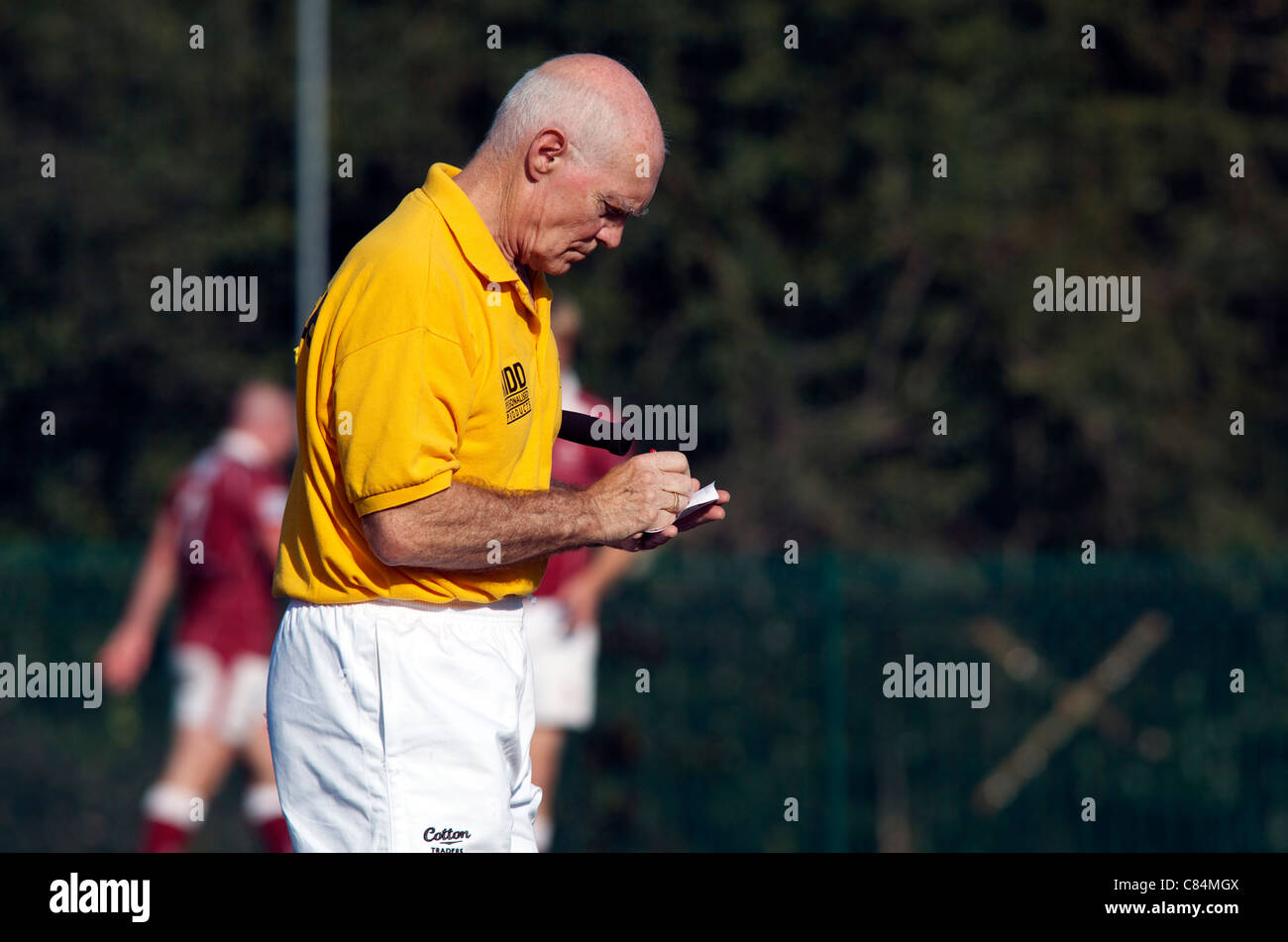 rugby referee notes that a penalty has been scored Stock Photo - Alamy