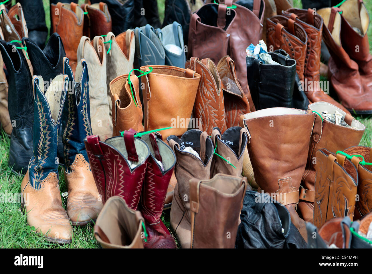 Rows of boots for sale Stock Photo - Alamy