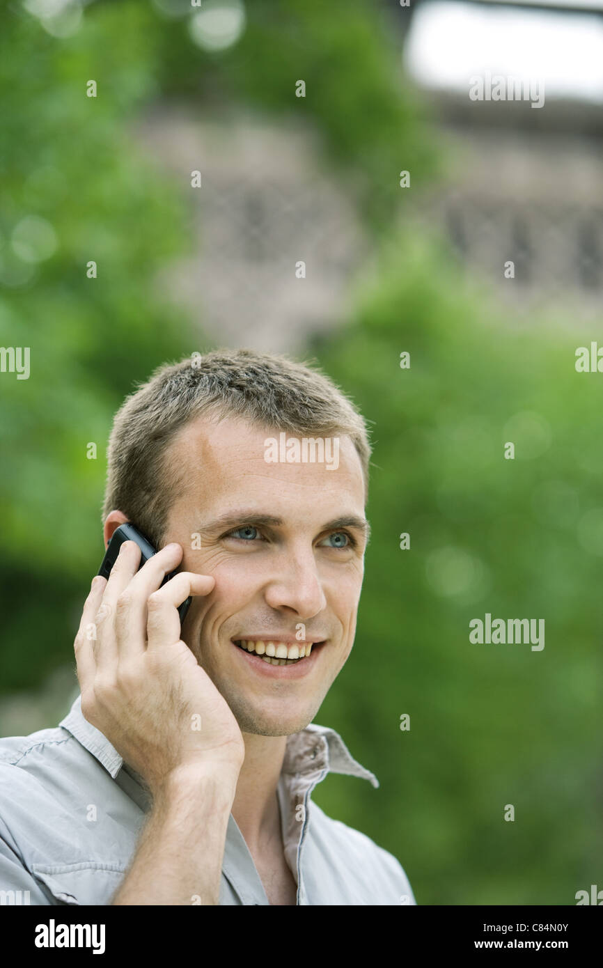 Man using cell phone outdoors Stock Photo - Alamy