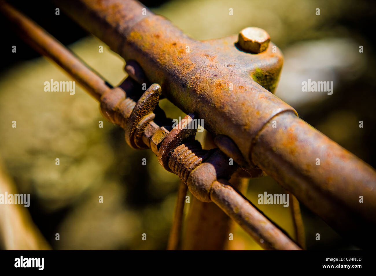 Picture of an old, rusty bicycle taken in the seating area of a cafe in ...