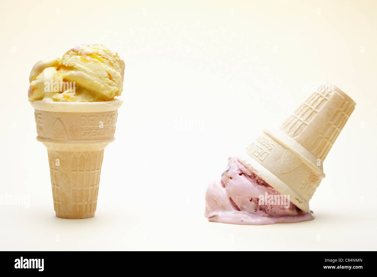 Vanilla ice cream cone and another crushed strawberry ice cream cone ...