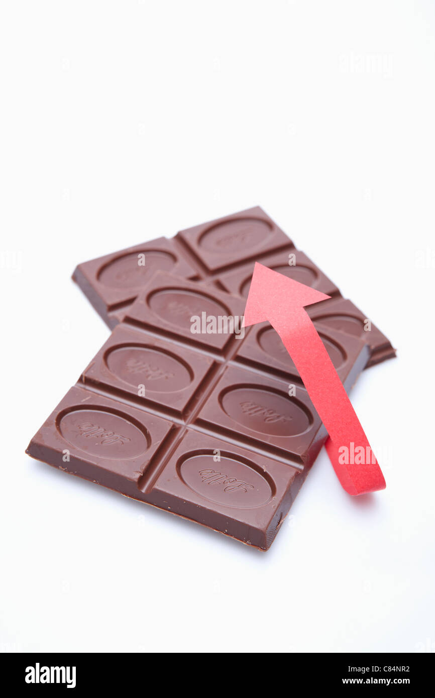 Chocolate with red arrow Stock Photo - Alamy