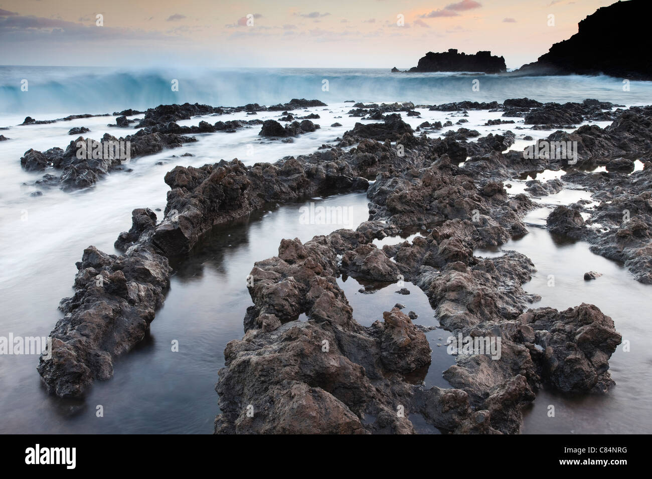 Rock formations on beach Stock Photo - Alamy
