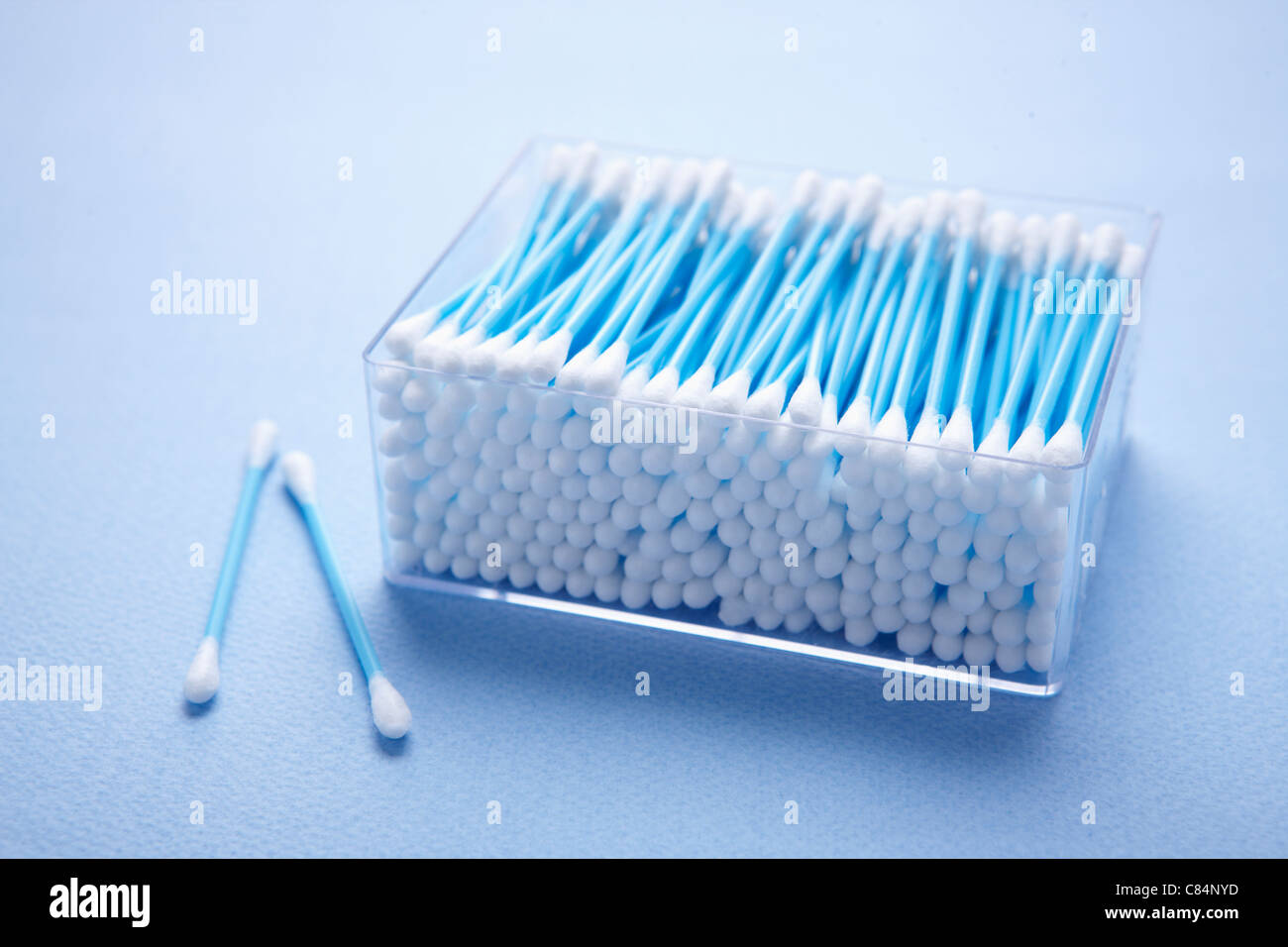 Blue cotton swabs in plastic container Stock Photo - Alamy