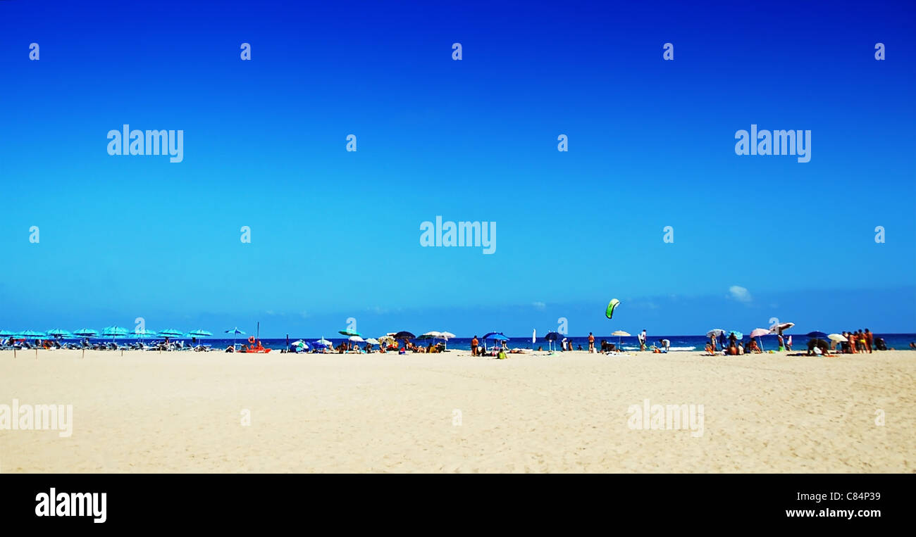 A panoramic beach scene, with distant crowds on the horizon Stock Photo ...