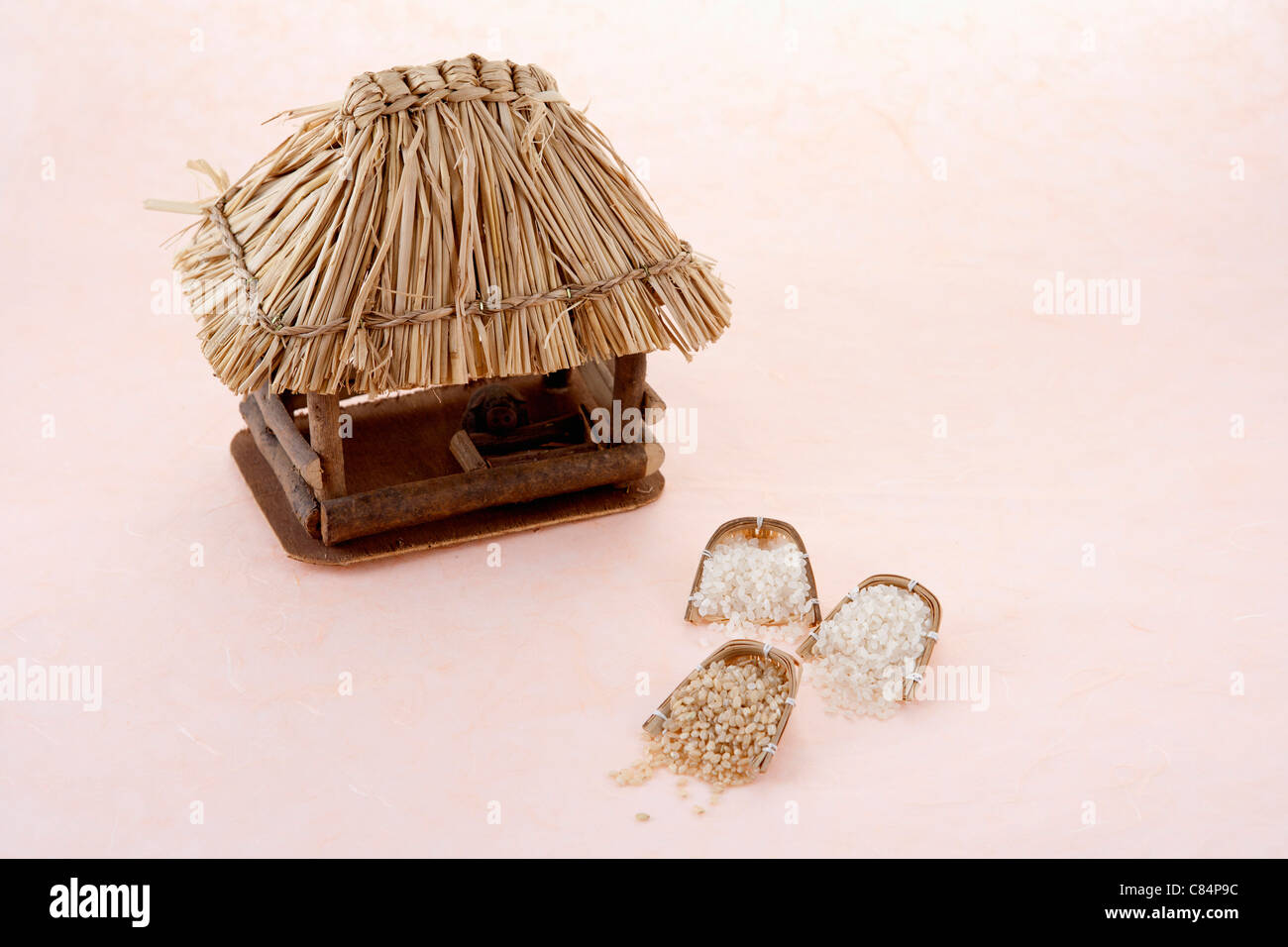 A straw house with small strainers Stock Photo - Alamy