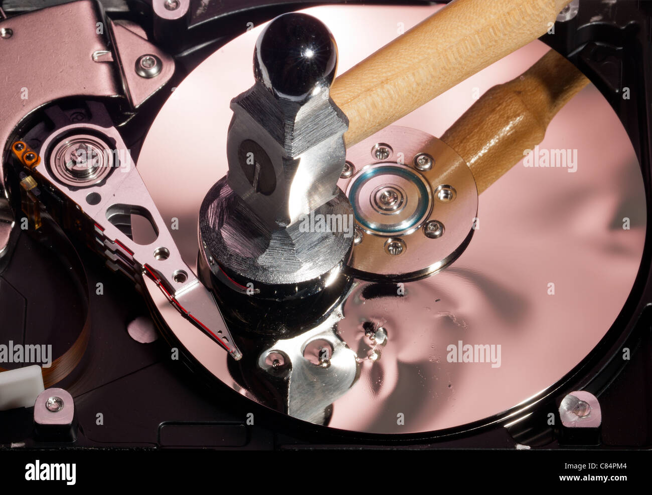 Magnetic disc inside a computer hd unit showing damage to the mirror ...