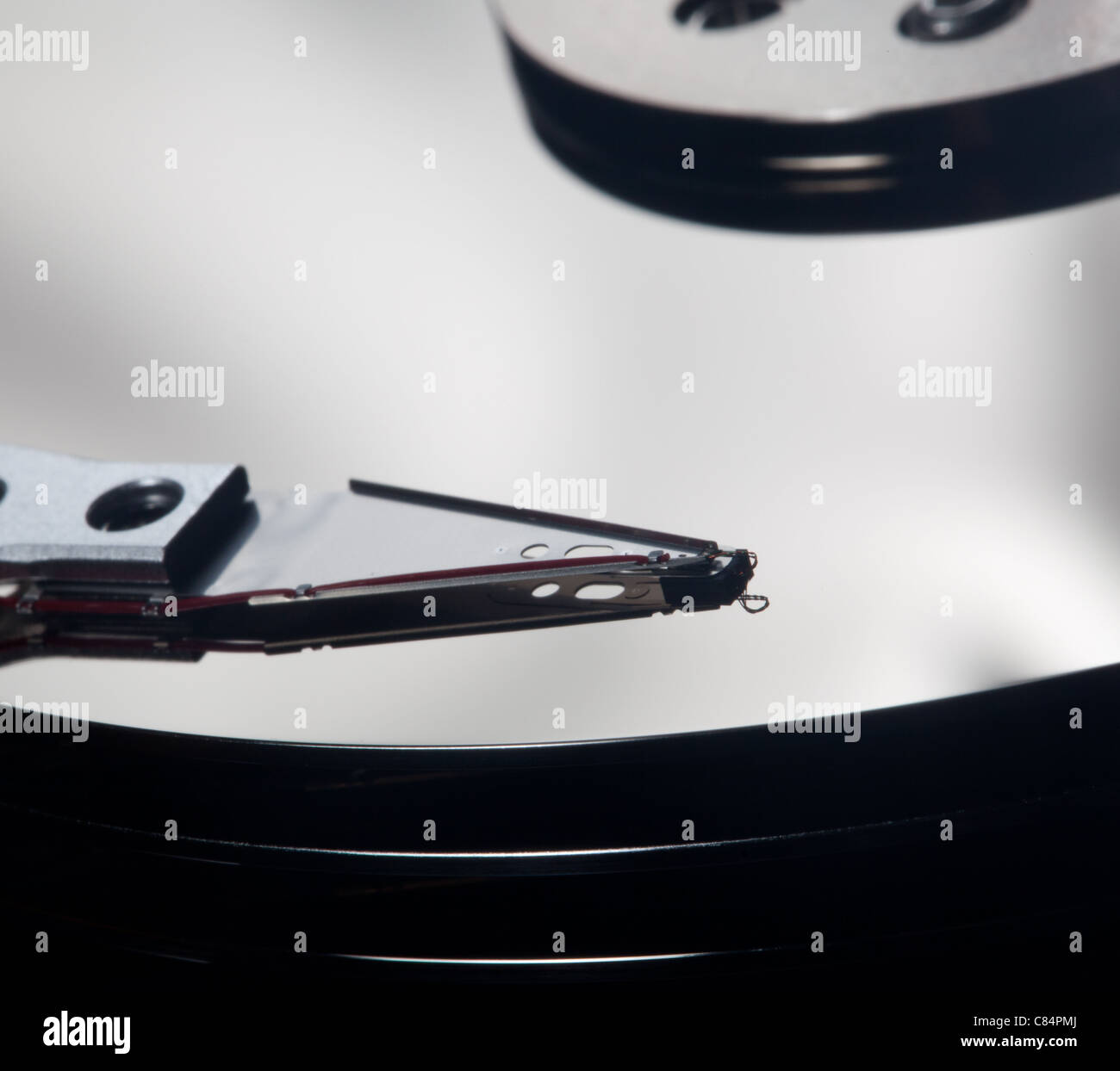 Magnetic disc inside a computer hd unit showing mirror surface of the ...