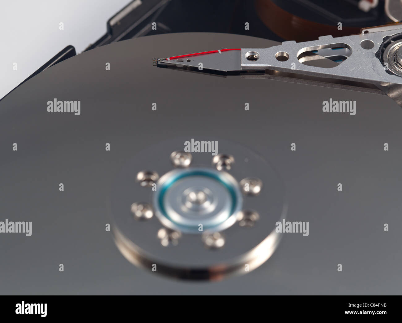 Magnetic disc inside a computer hd unit showing mirror surface of the ...