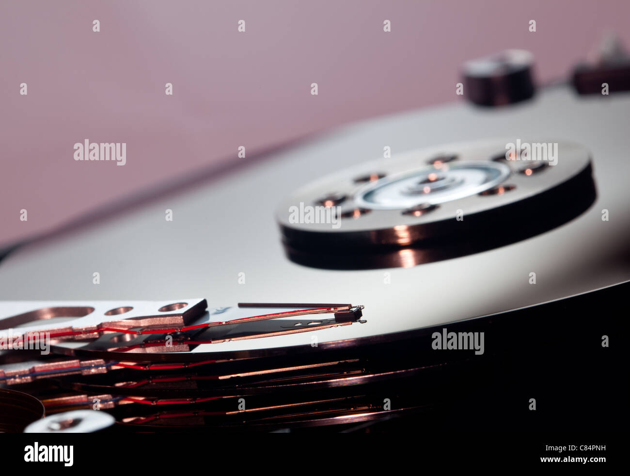 Magnetic disc inside a computer hd unit showing mirror surface of the ...