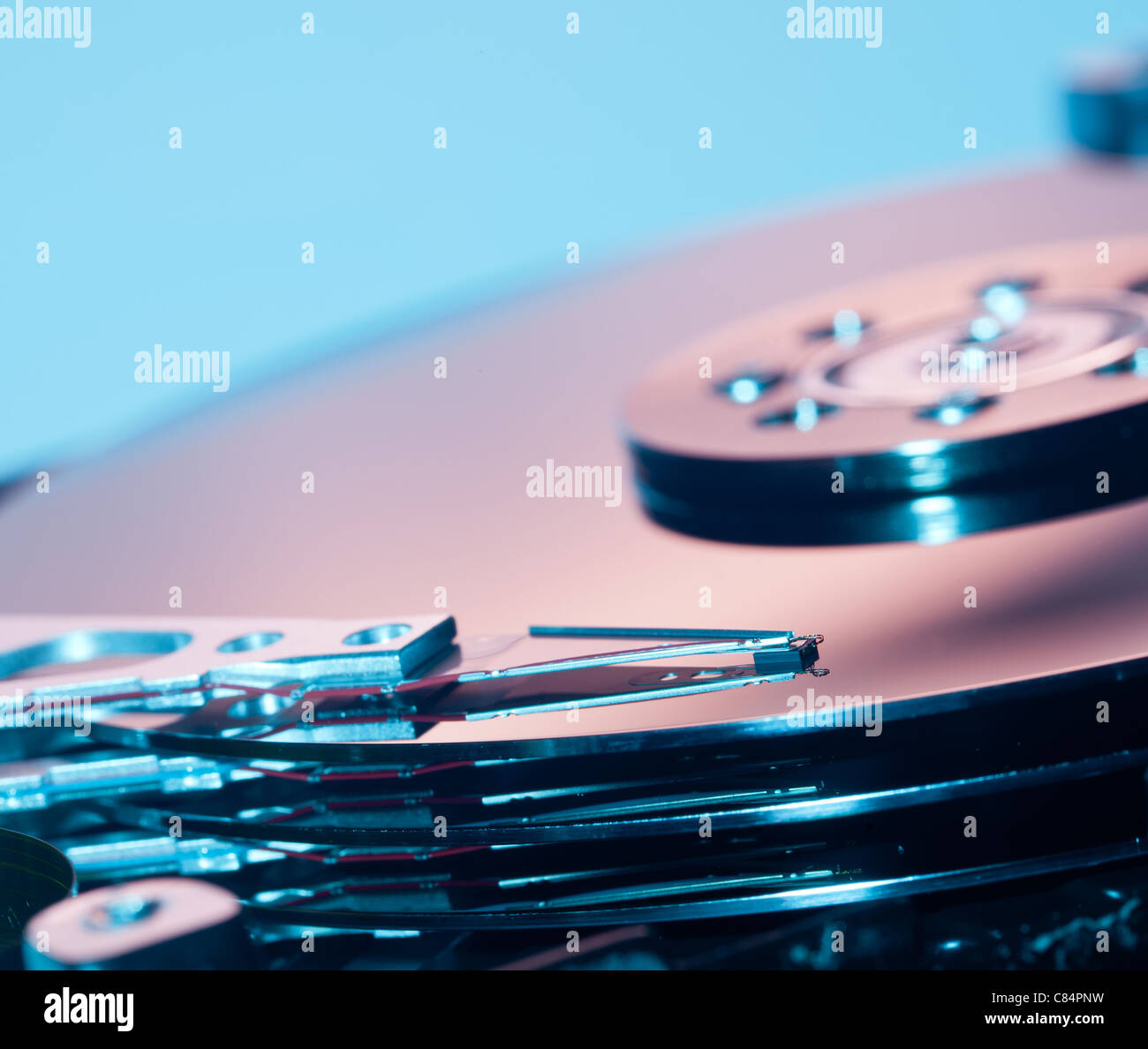 Magnetic disc inside a computer hd unit showing mirror surface of the ...