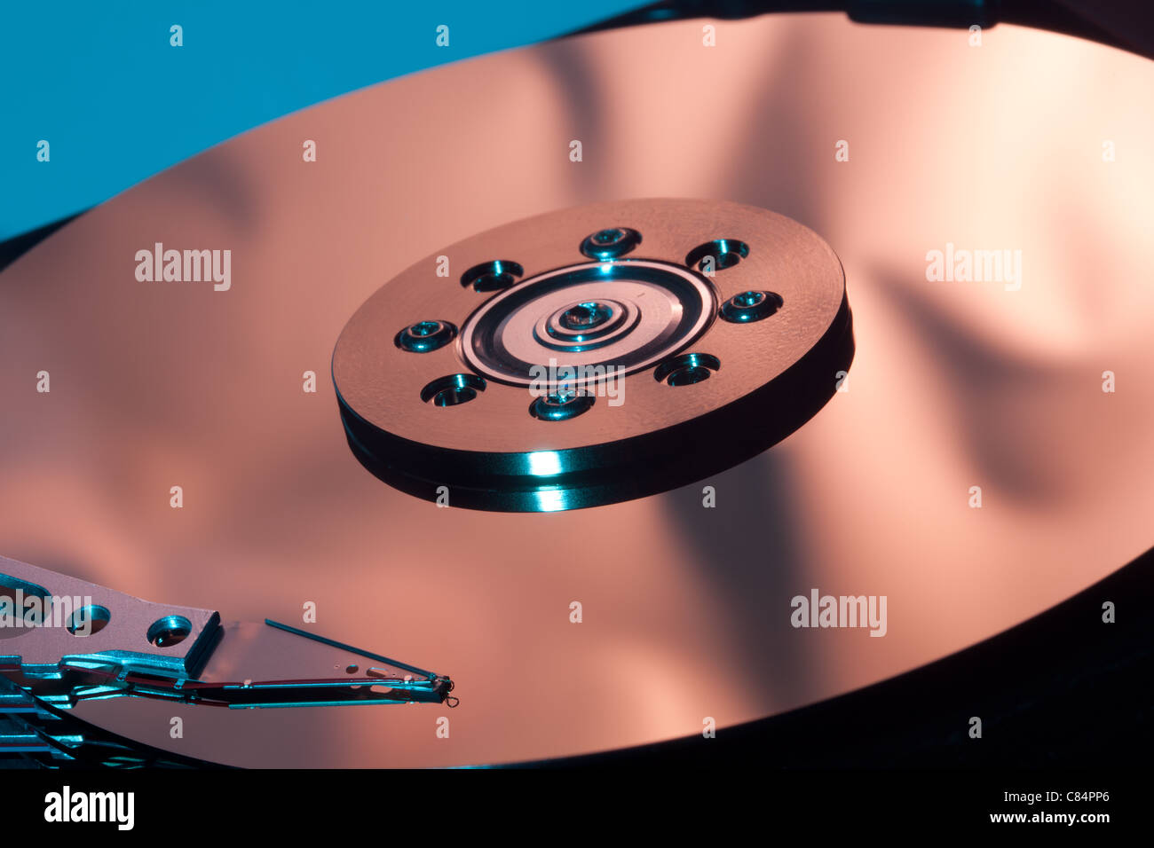 Magnetic disc inside a computer hd unit showing mirror surface of the ...