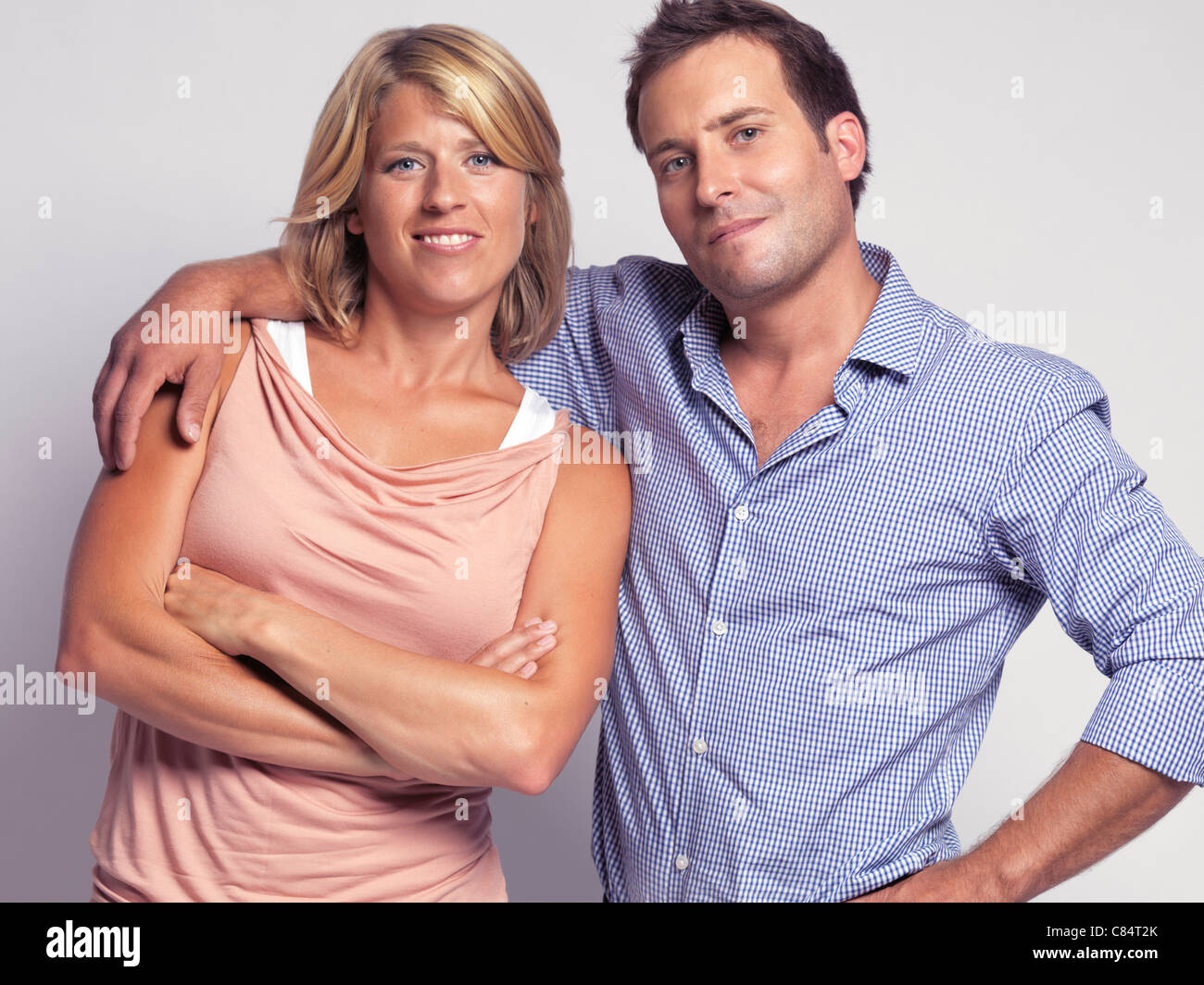 Portrat of smiling casually but with style dressed young man and a ...