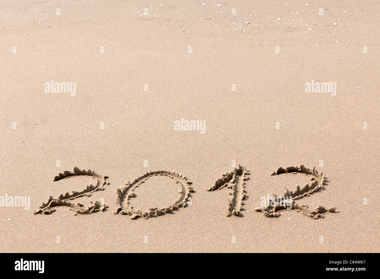 2012 Year written on the beach sand Stock Photo - Alamy