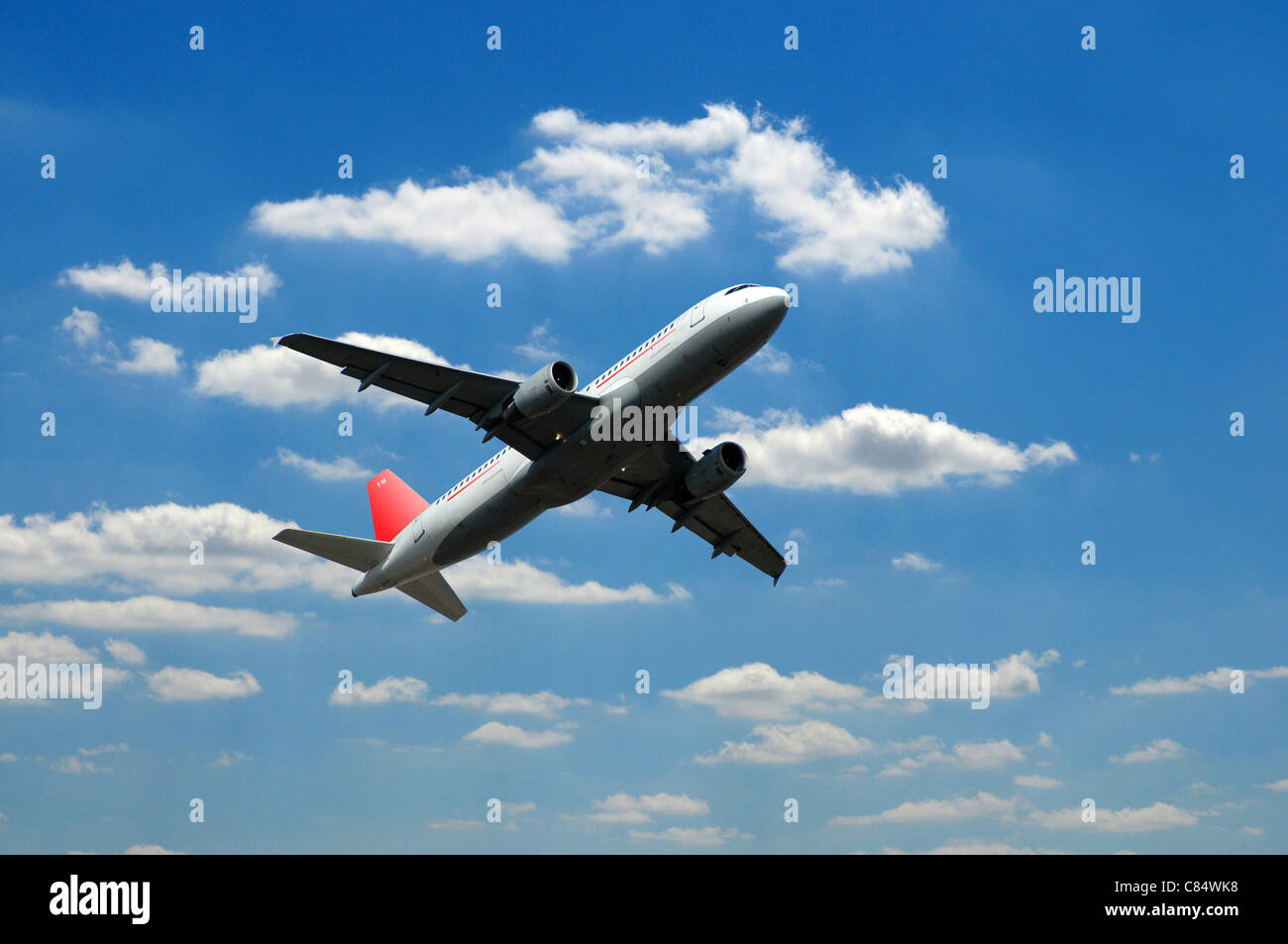 Passenger Airplane after start. In front of a blue sky Stock Photo - Alamy