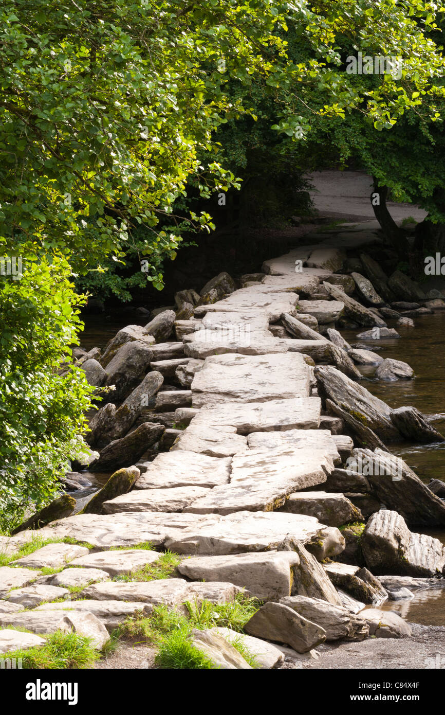 The prehistoric clapper bridge across the River Barle at Tarr Steps ...