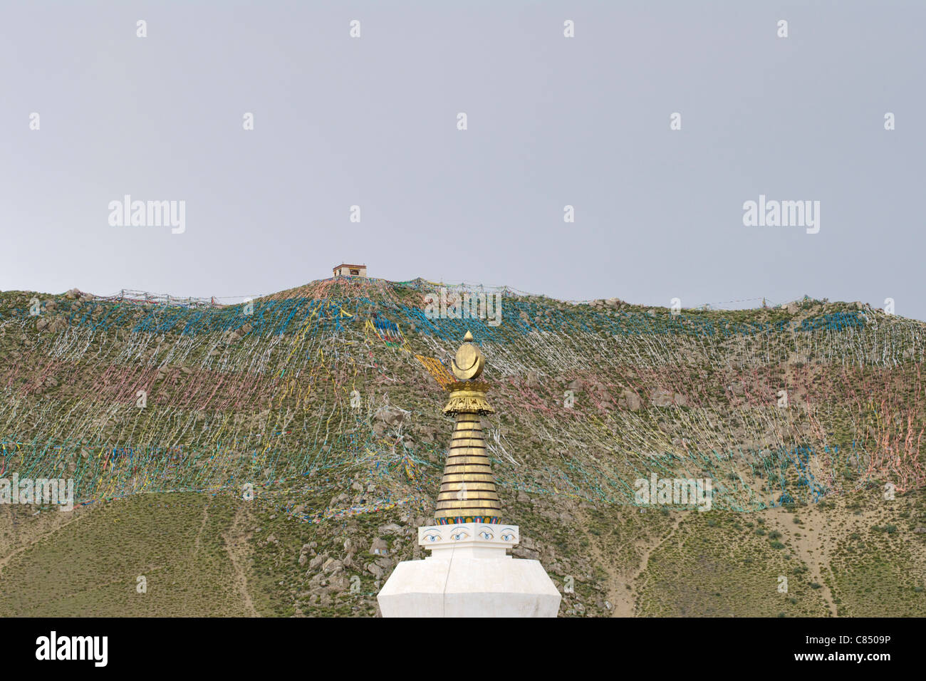 Samye white chorten and prayer flags Stock Photo - Alamy