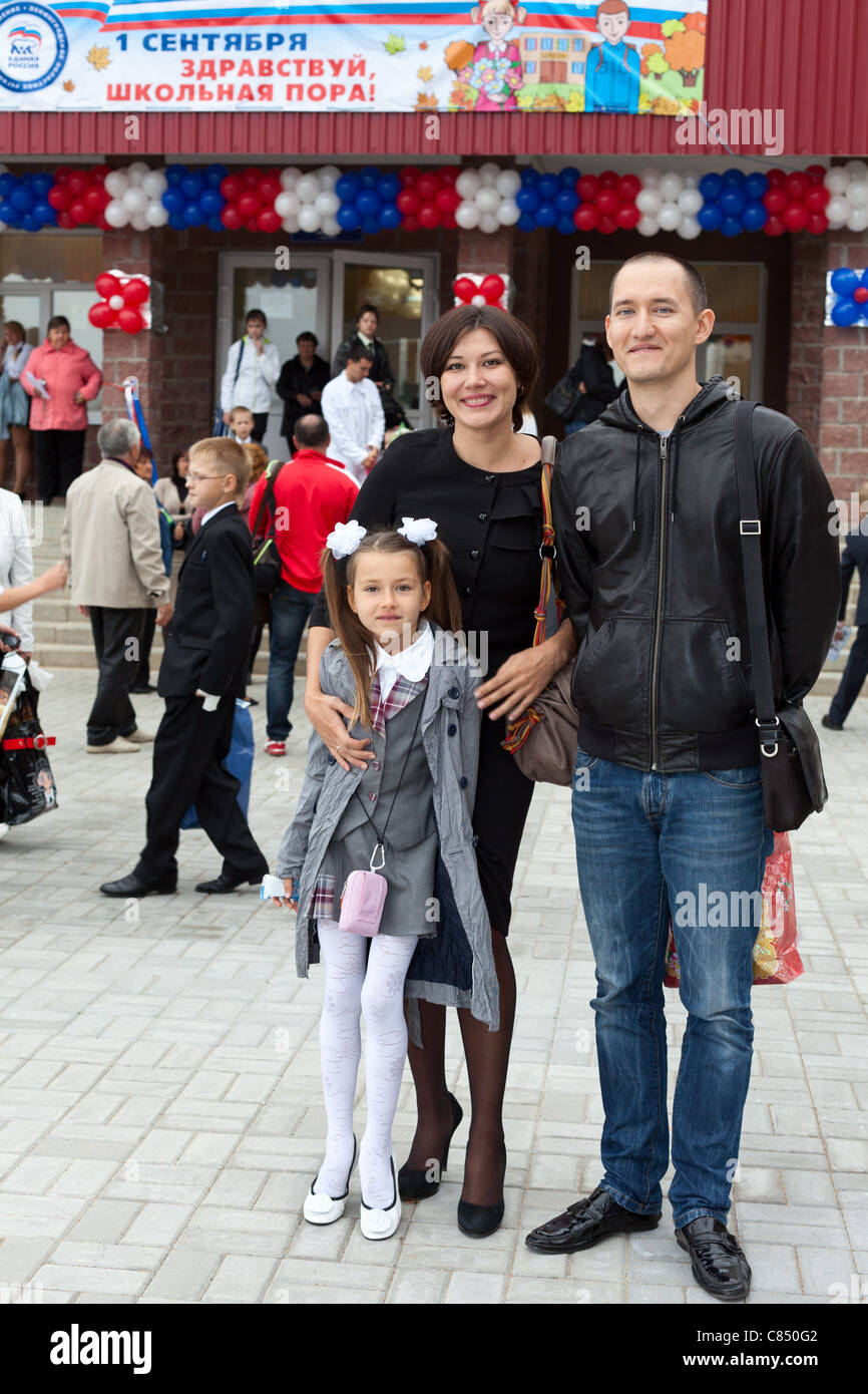Russian parents and school-girl near school building Stock Photo - Alamy