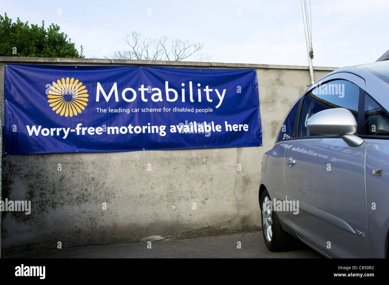 A car parked next to a " motability " sign, uk Stock Photo - Alamy