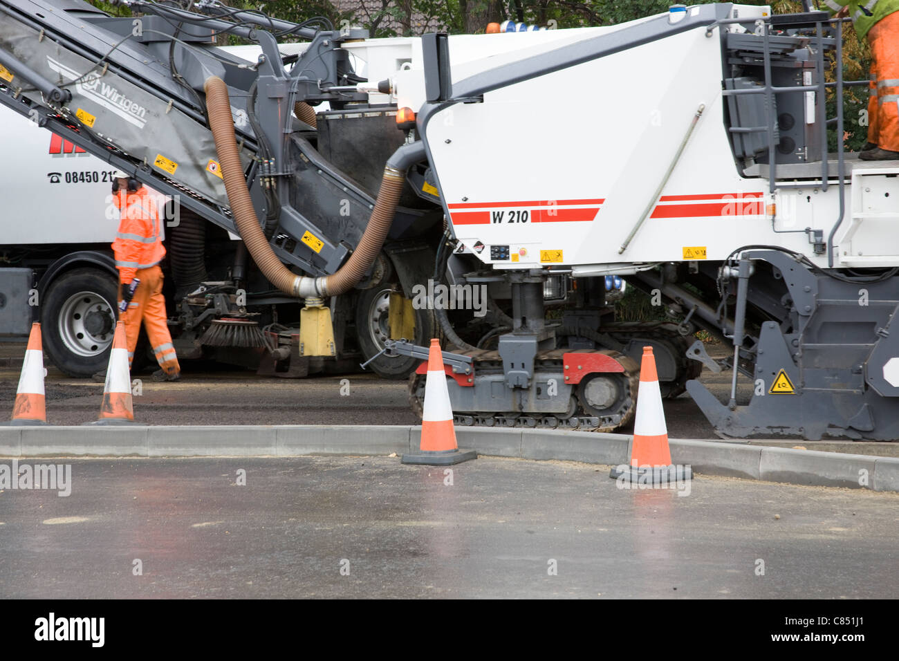 Surface of road being removed by a planer ready for a new tarmac ...