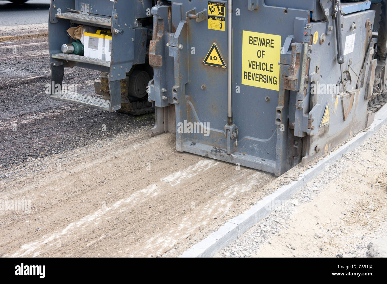 Surface of road being removed by a planer ready for a new tarmac ...