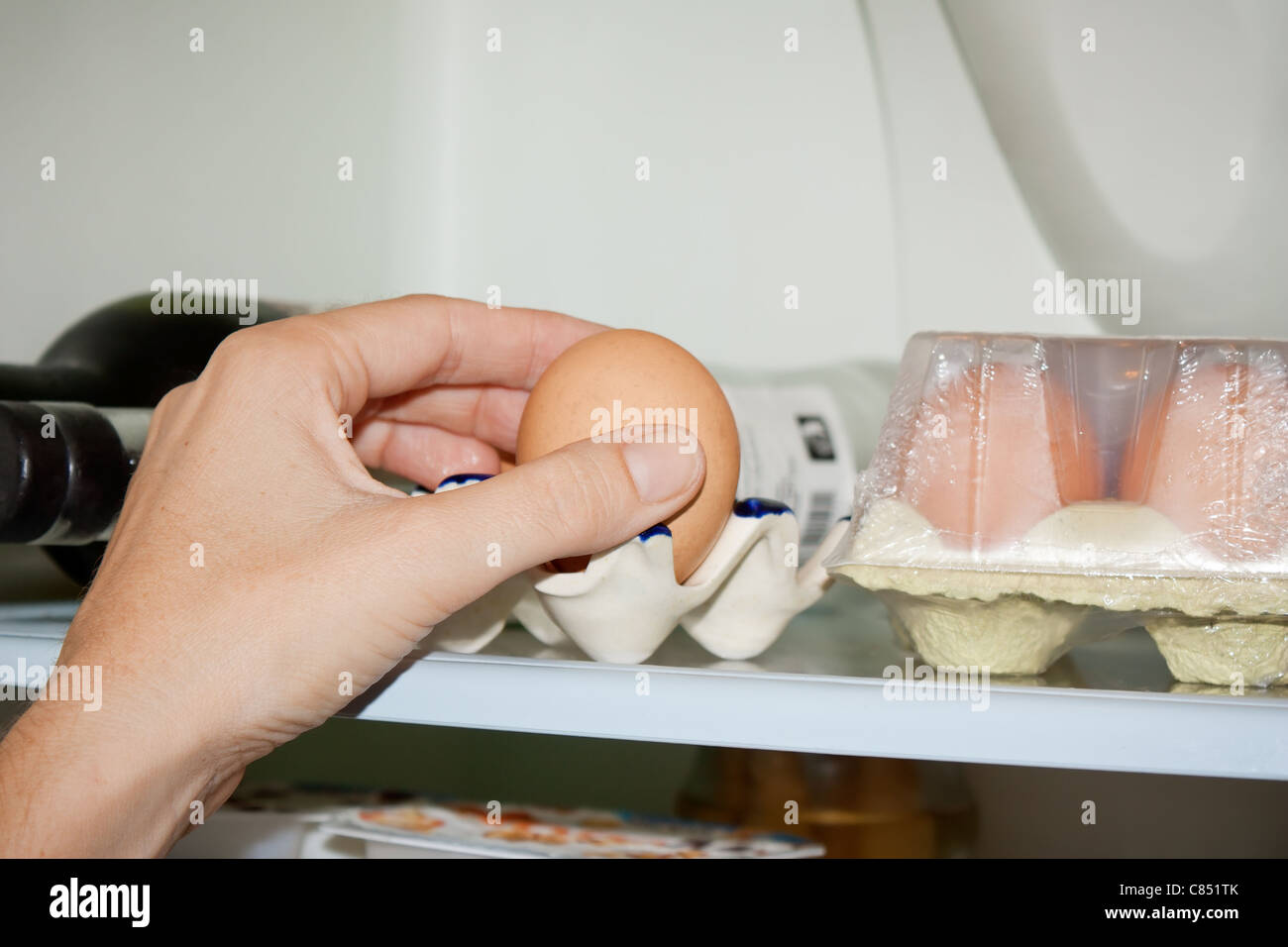 Hand take egg hi-res stock photography and images - Alamy