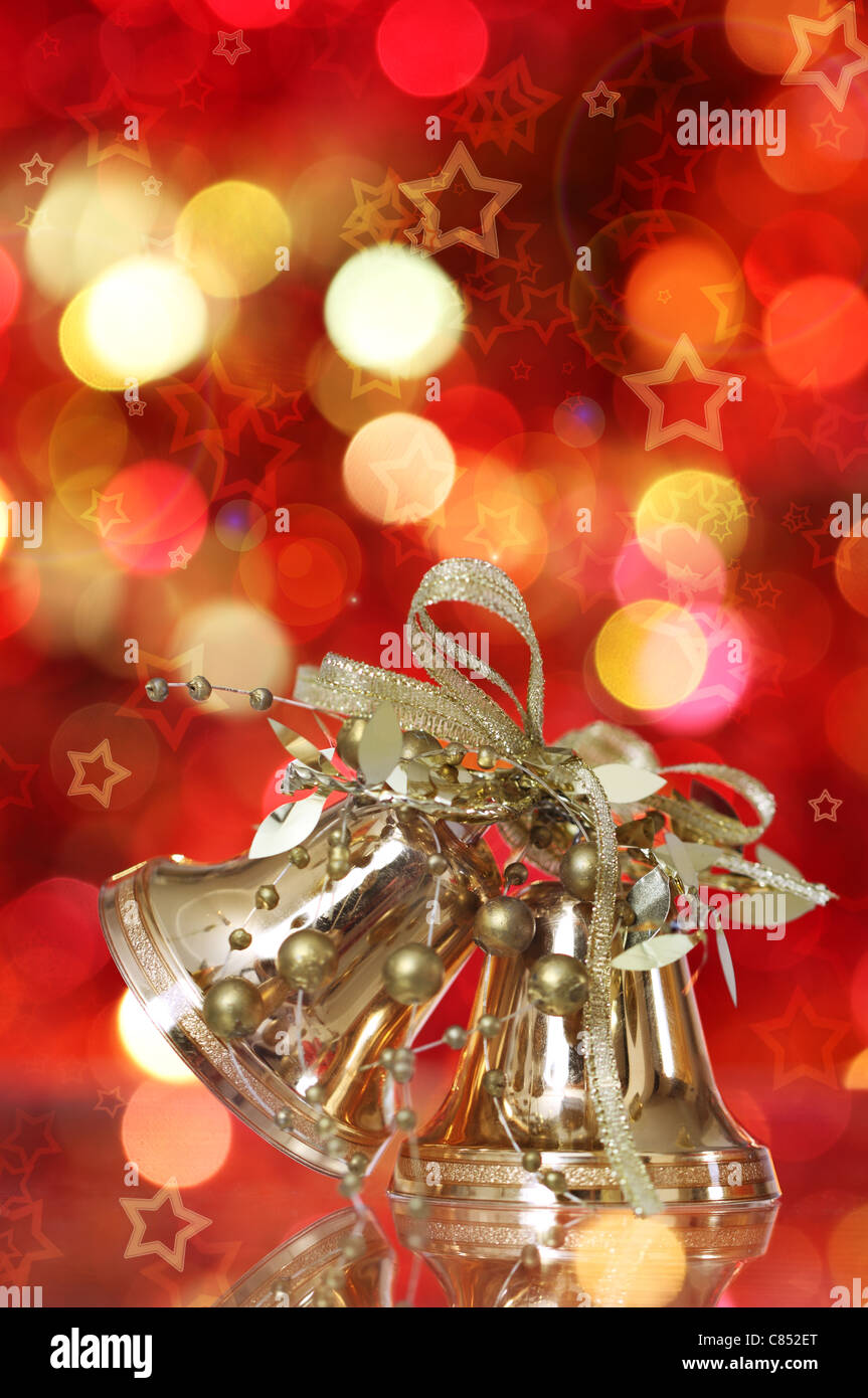 Golden Christmas bell tree decorations on lights background Stock Photo ...