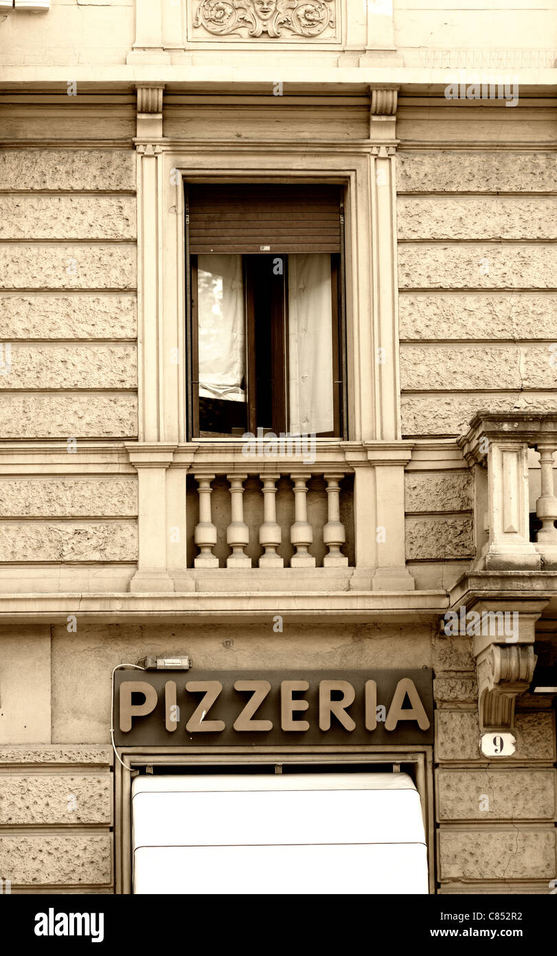 A pizzeria in an old stone building in Italy Stock Photo - Alamy