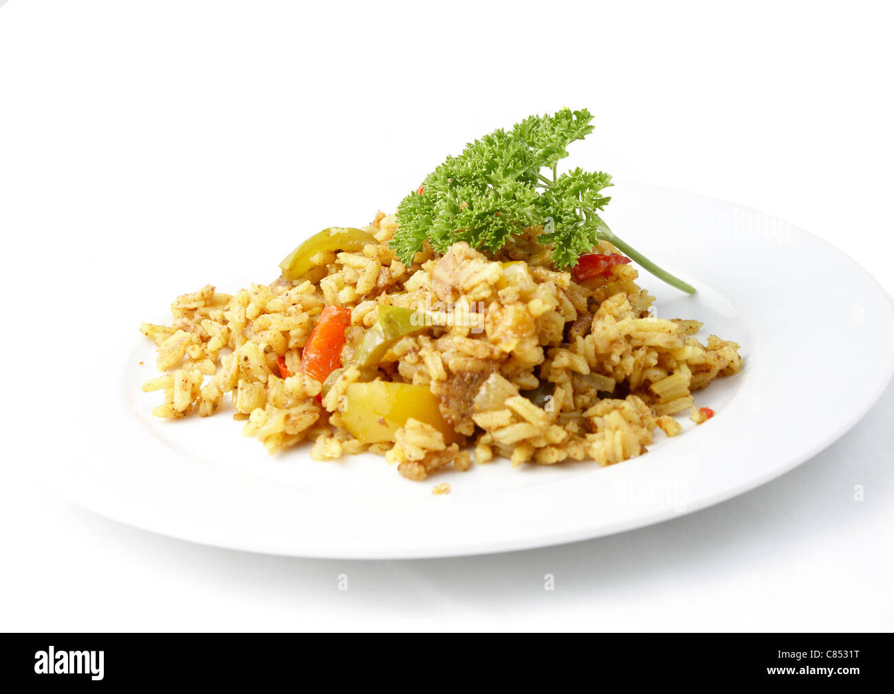 A savoury rice dish dressed with a sprig of parsley with plain white ...