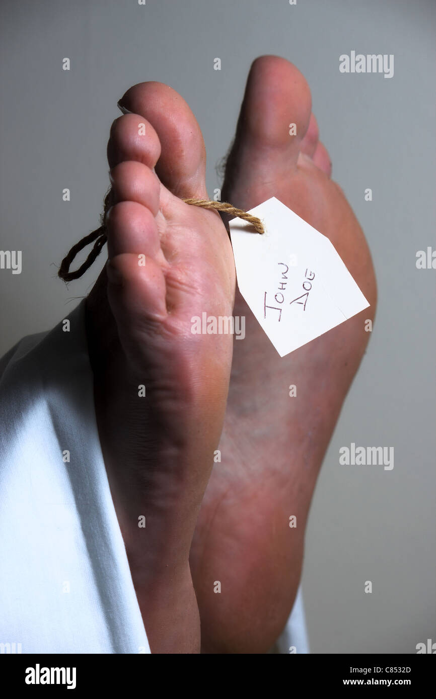 The feet of a corpse with a John Doe name tag Stock Photo - Alamy