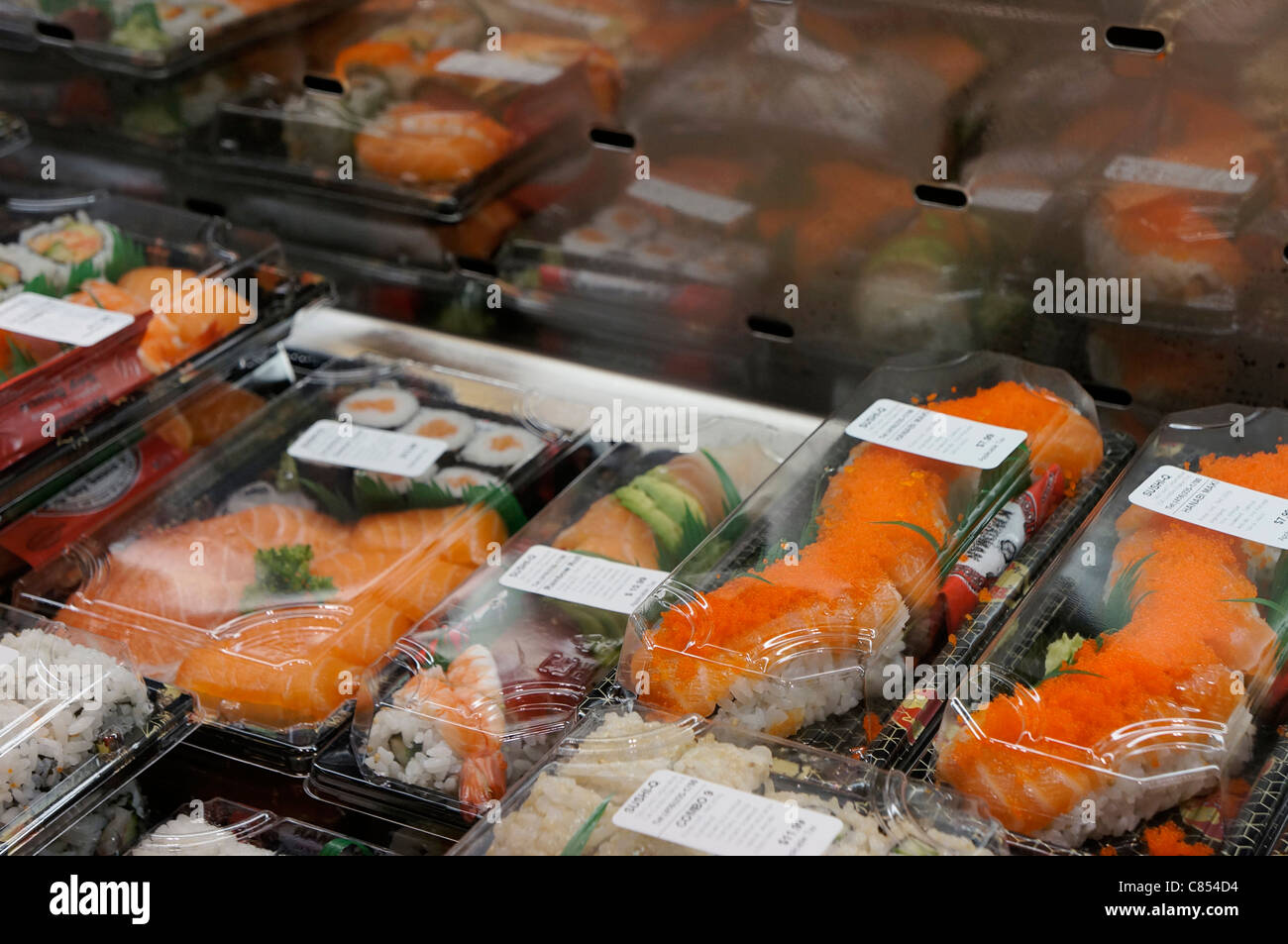 Sushi packaged in plastic containers, in fridge/freezer section Stock ...