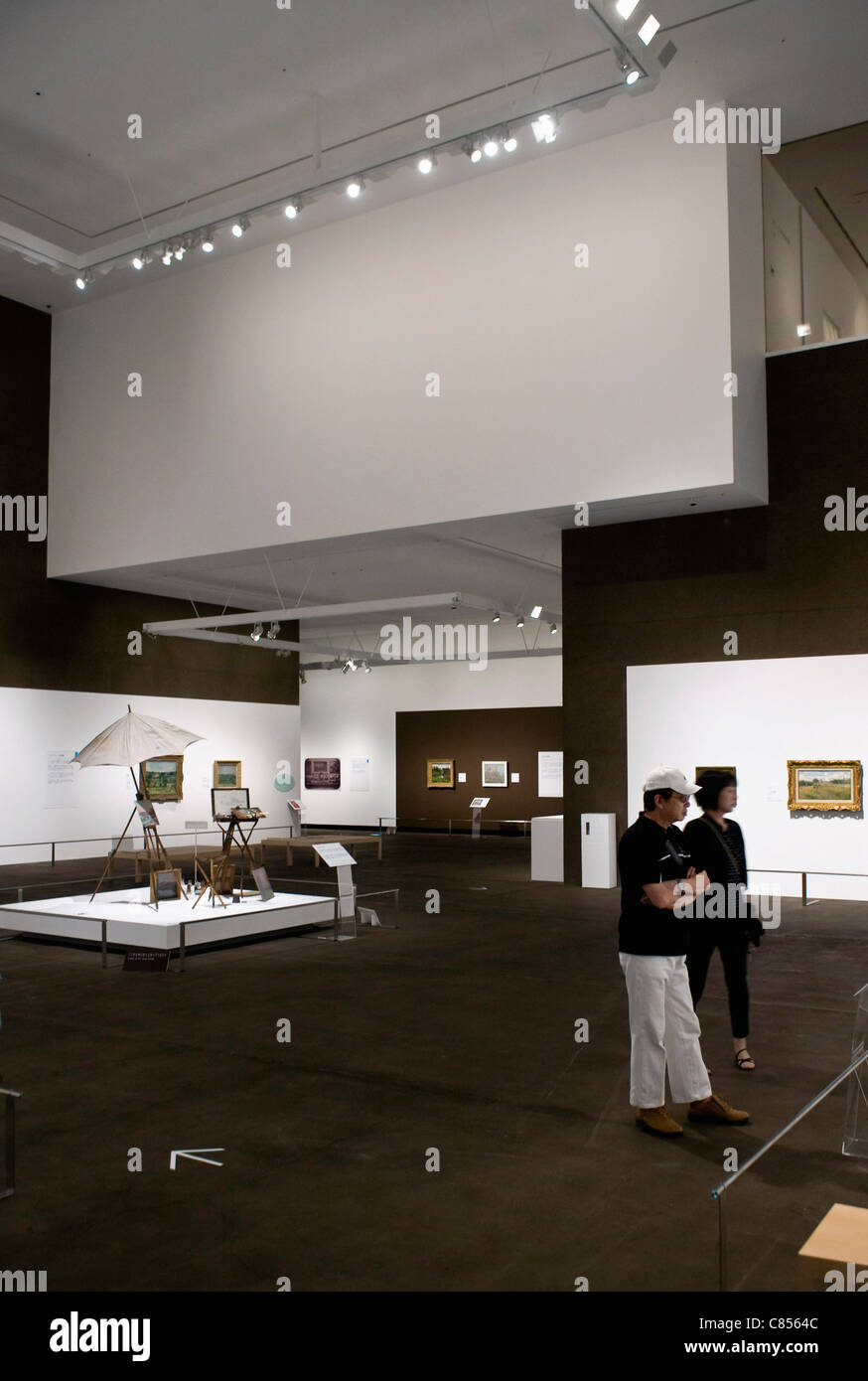 Visitors enjoy an exhibition of Impressionist works inside the ...