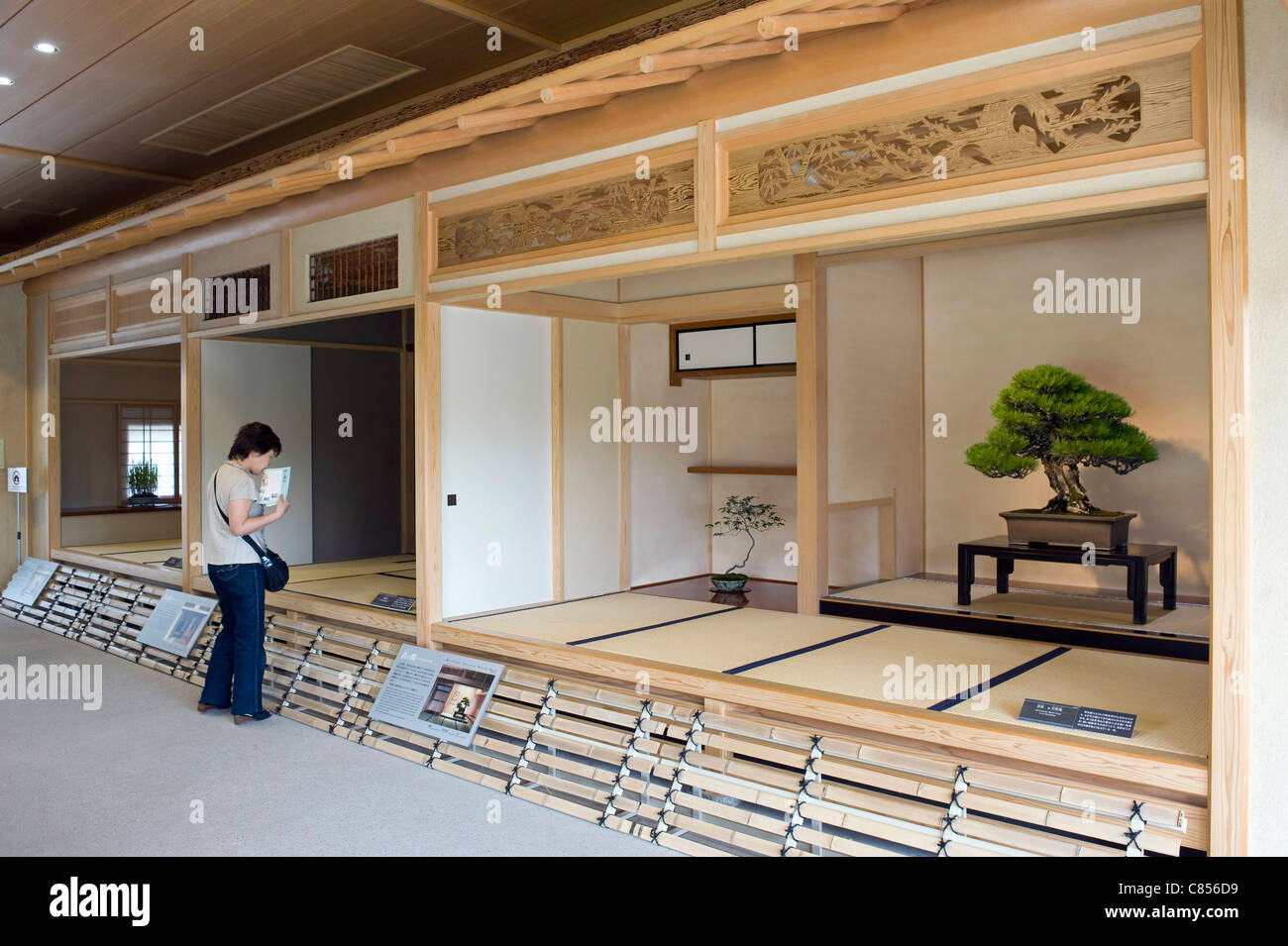 A visitor looks at different styles of Japanese "zashiki" rooms at the ...