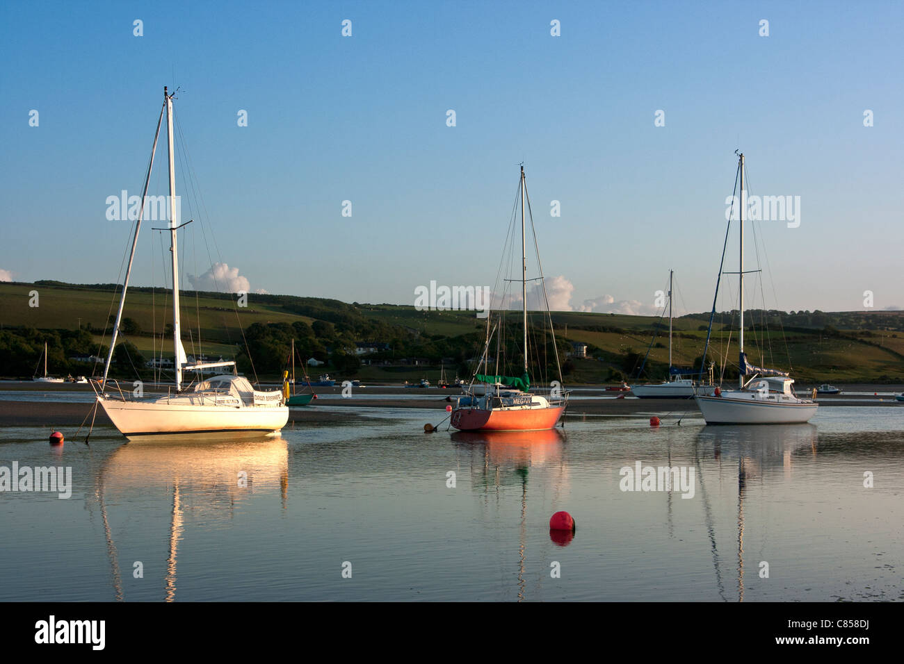 Moored yachts in early evening, Cardigan Bay, West Wales Stock Photo ...