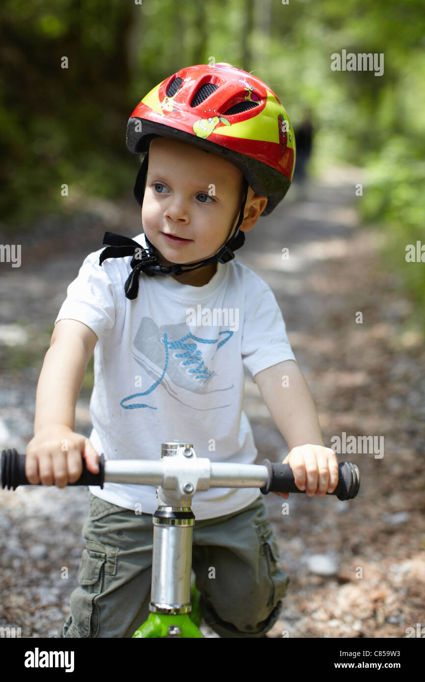 Toddler boy riding bike Stock Photo - Alamy