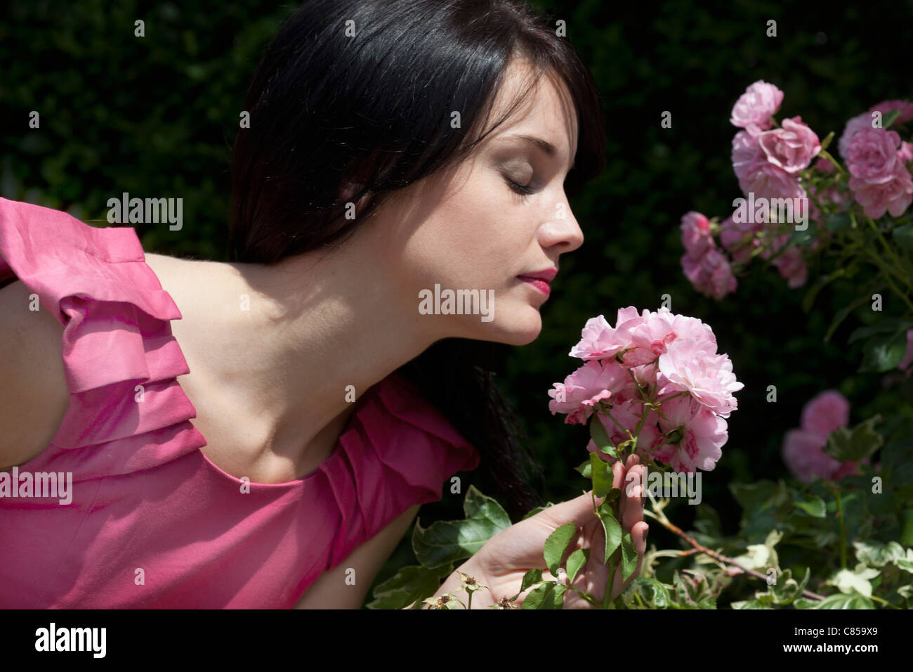 Woman Smelling Rose Outside High Resolution Stock Photography and ...