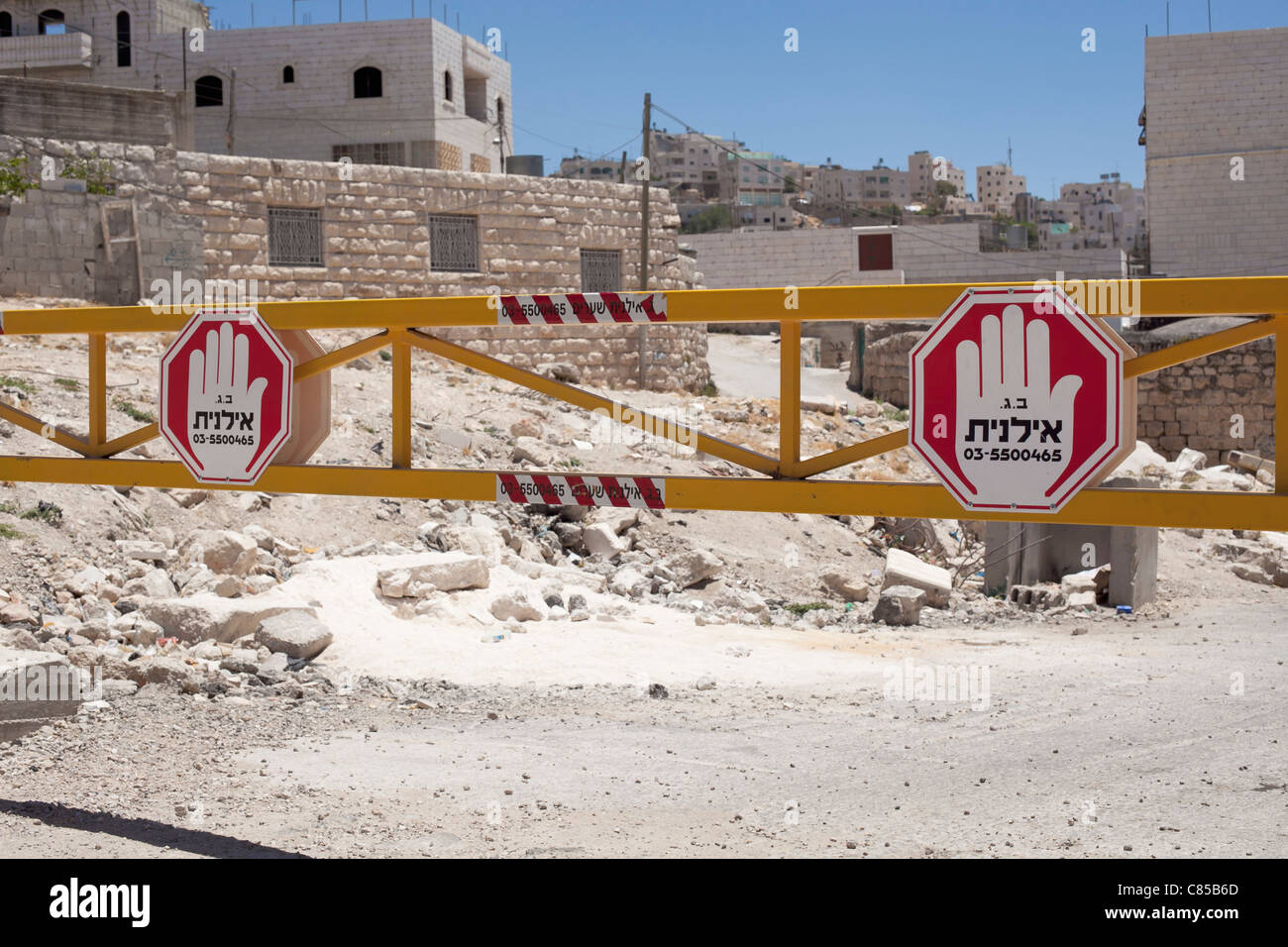 A barrier with sign warning in hebrew not to cross over, central Hebron ...