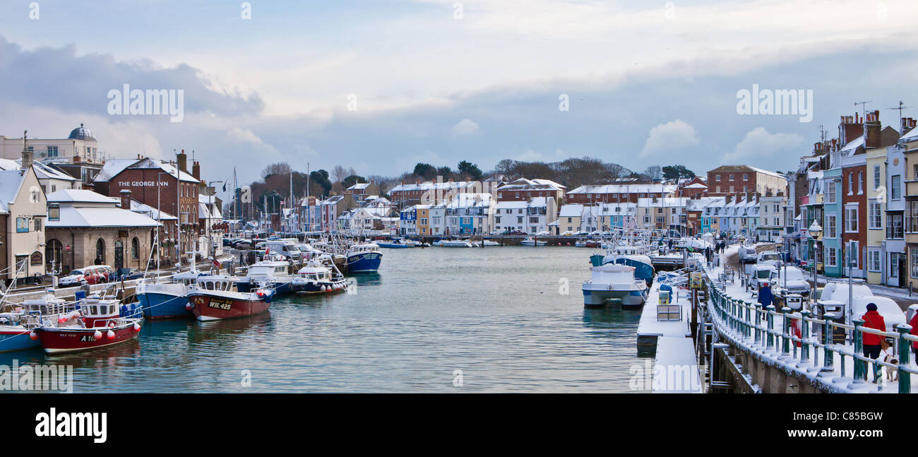 snow across Weymouth harbour in the winter Stock Photo - Alamy