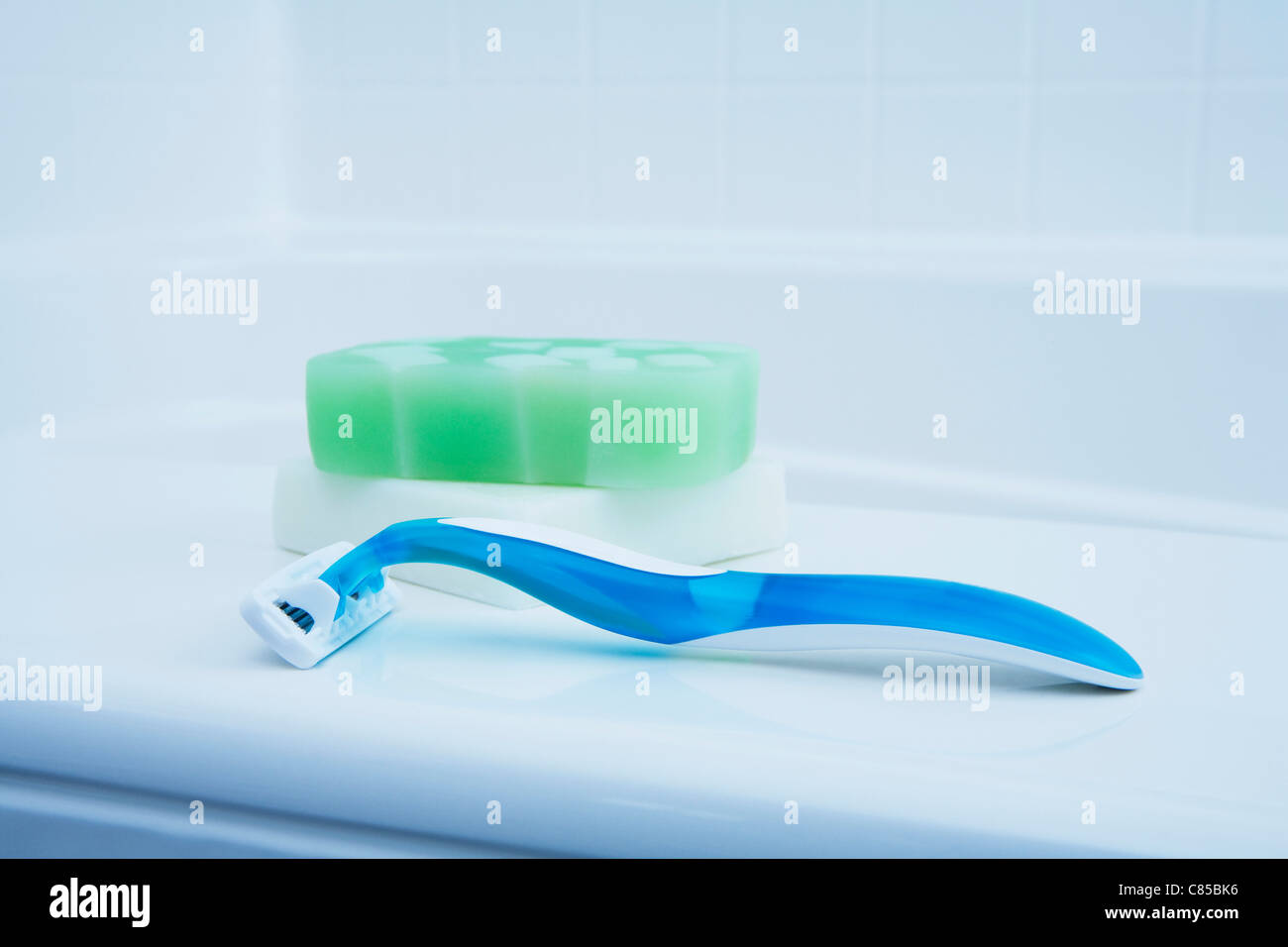 Soap and Razor on edge of Tub Stock Photo - Alamy