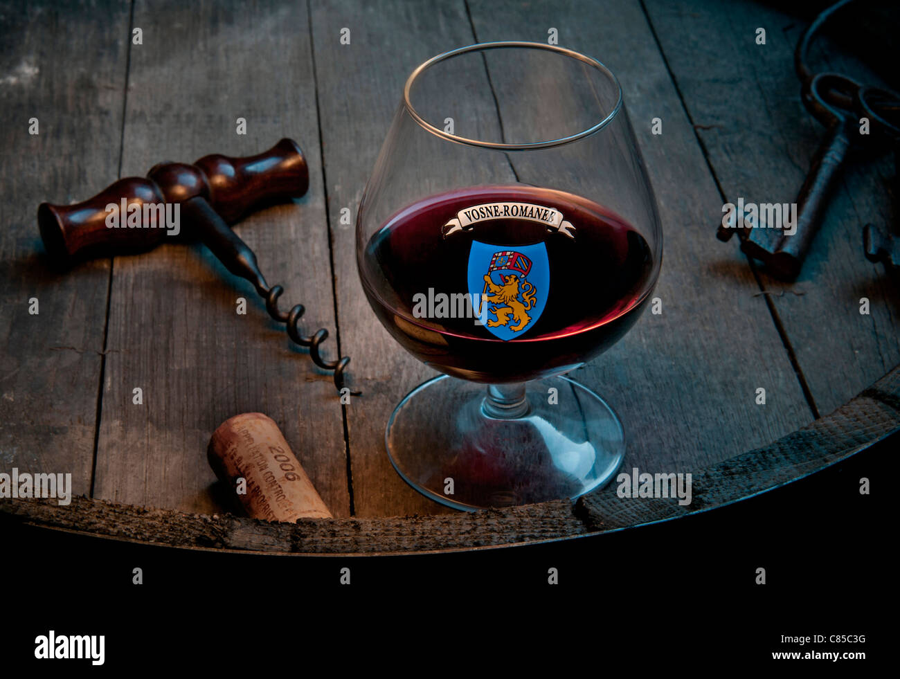 VOSNE-ROMANÉE French wine tasting situation in cellar with glass of ...