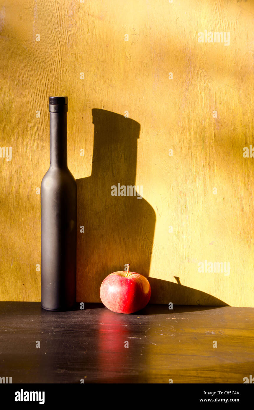 evening still-life with bottle and shadows Stock Photo - Alamy