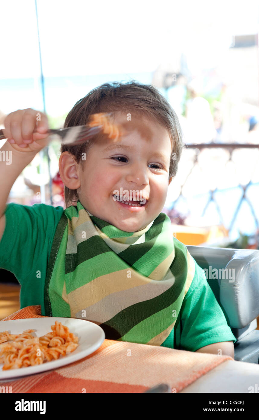 Boy Eating Pasta in Restaurant, Playa del Carmen, Mexico Stock Photo ...