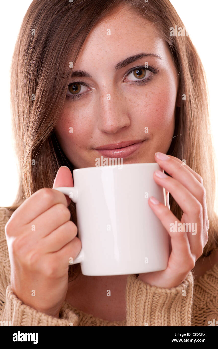 young woman drinking tea from a mug Stock Photo - Alamy