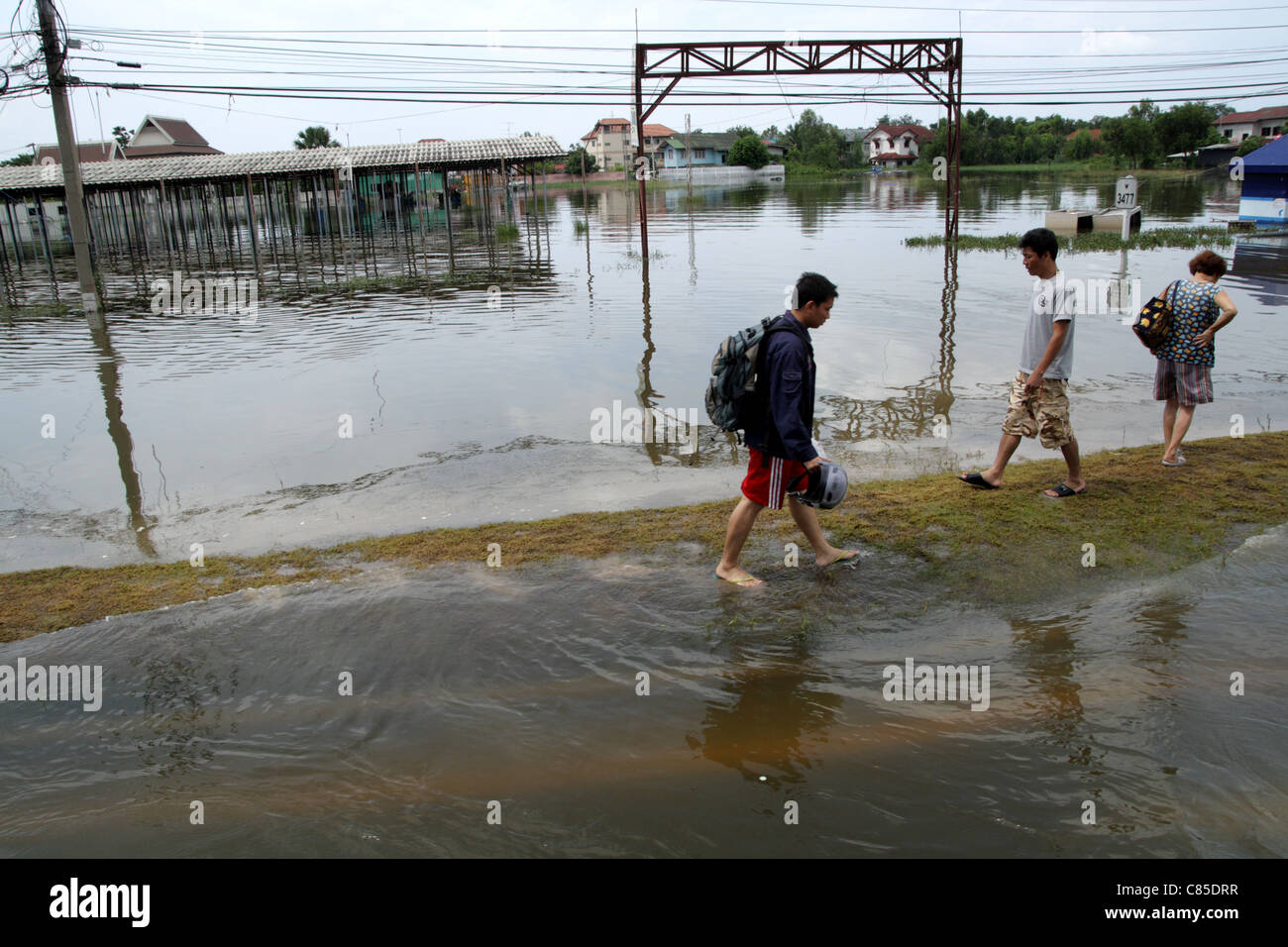Thai people wading through floodwater in Ayutthaya , Thailand Stock ...