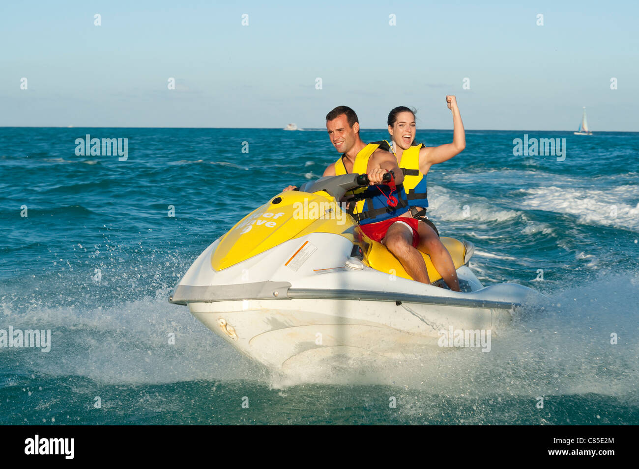 Couple on Personal Watercraft Stock Photo - Alamy